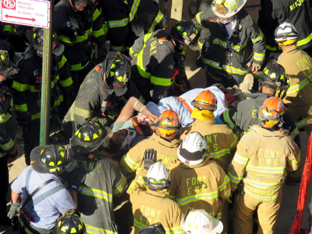 Firefighters rescue three trapped workers following a construction ...