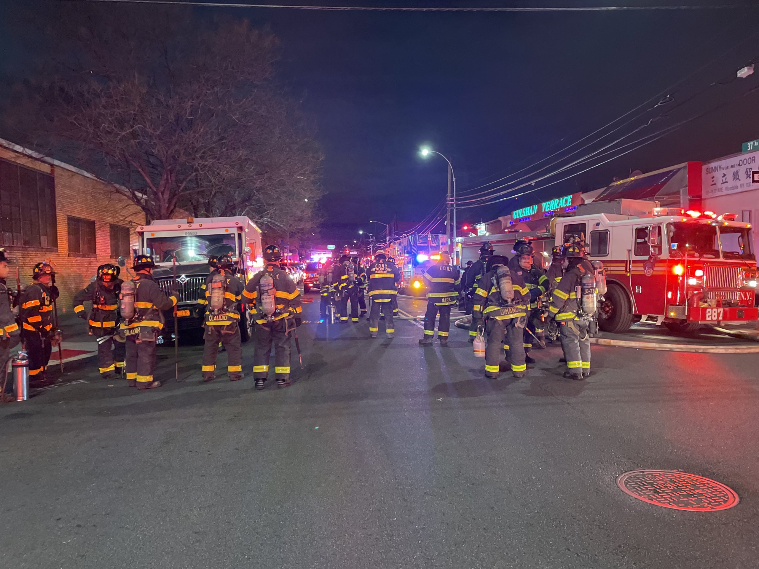Nine firefighters injured battling five-alarm fire in Woodside that ...