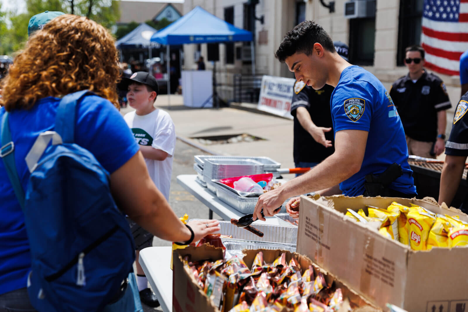 ‘Our way of giving back’: NYPD’s 102nd Precinct hosts block party in ...