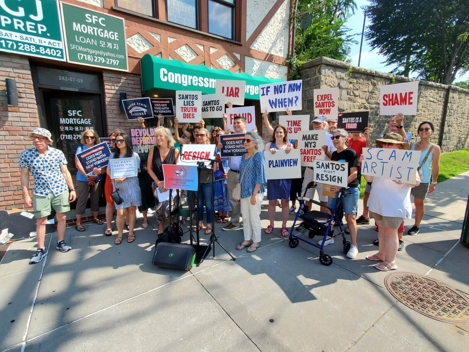 Constituents gather in front of George Santos’ Douglaston office ...