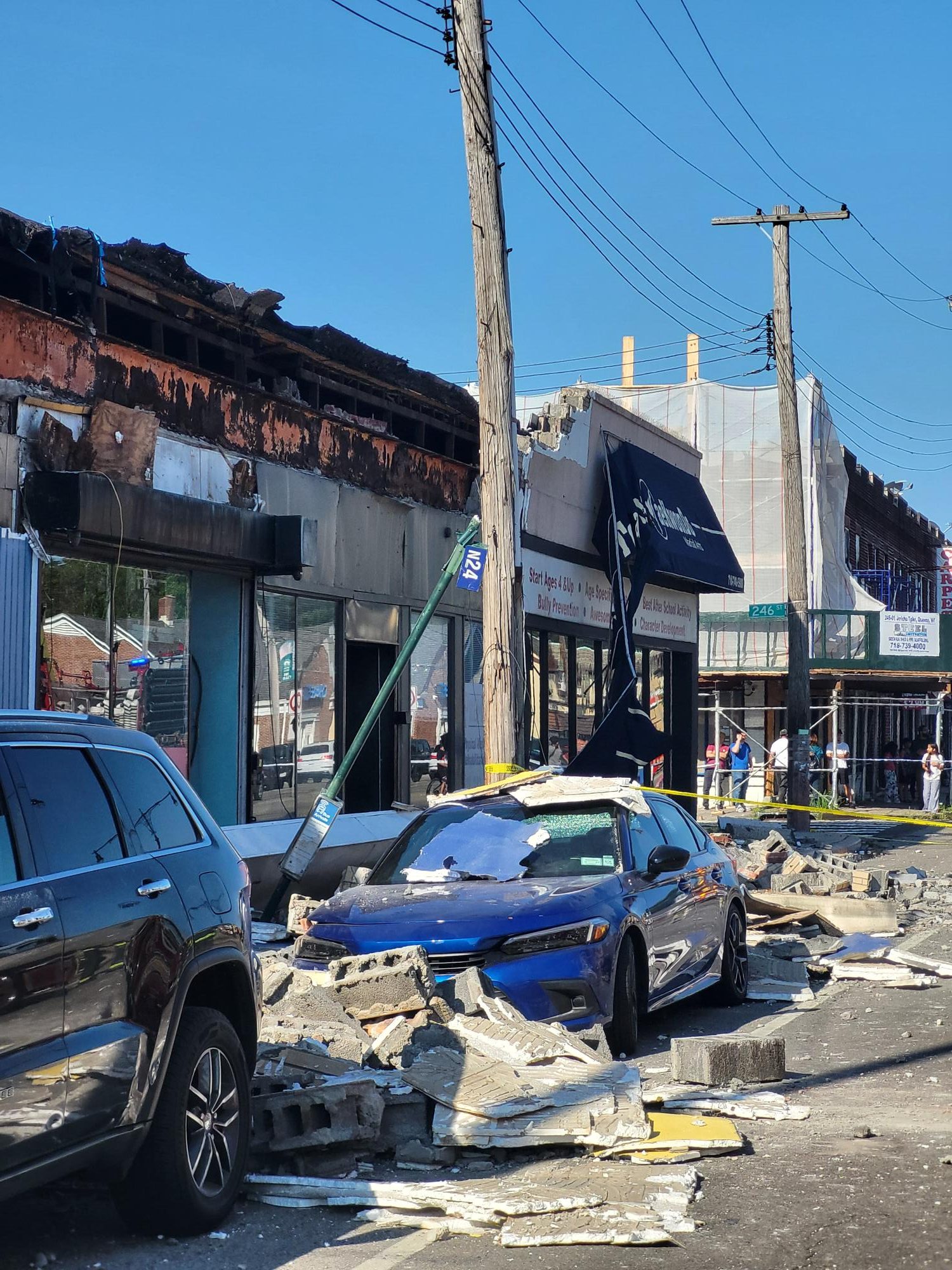 Three injured in partial wall collapse along a commercial strip in ...