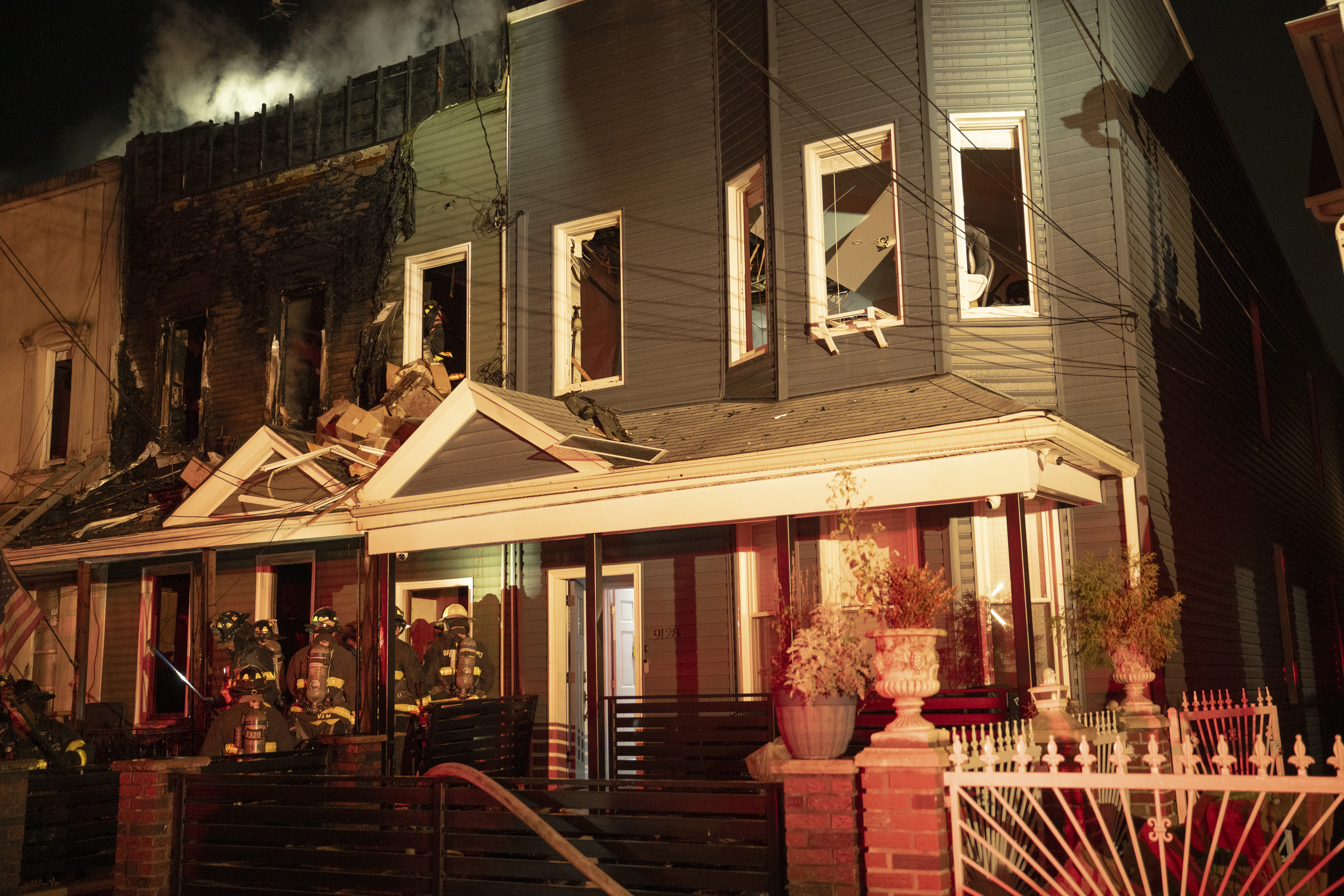 Nearly 20 residents displaced as five-alarm fire tears through four ...
